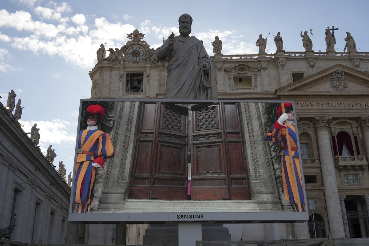 The conclave to elect a new pope officially begins as the doors to the Sistine Chapel close ...